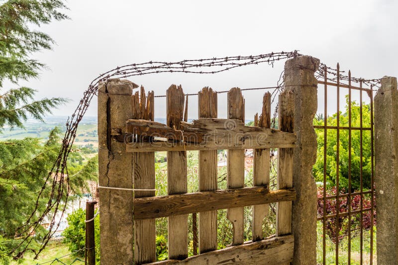 Old rusty gate in ruins stock photo. Image of security - 60131130