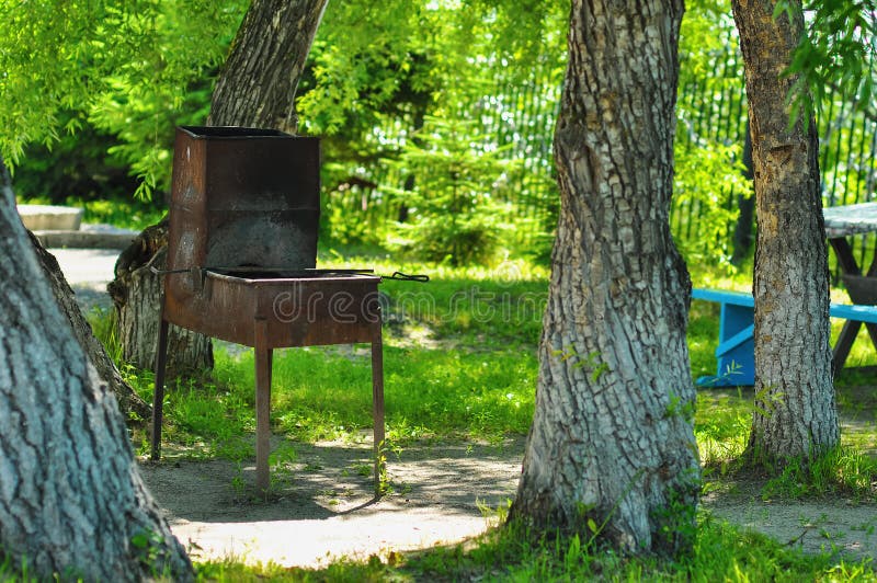 Old Rusty Grill on the Grass between the Trees Stock Image - Image of ...