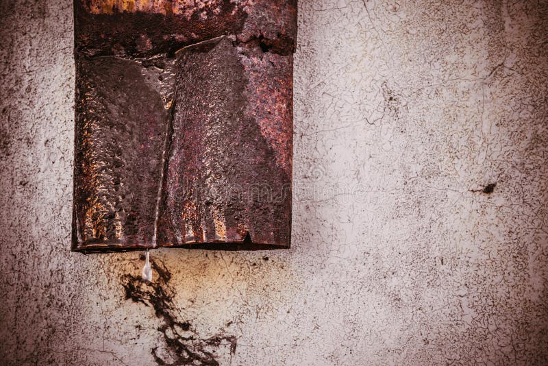 An Old Rusty Gutter Old Pipe Next To a Wall Stock Image - Image of ...