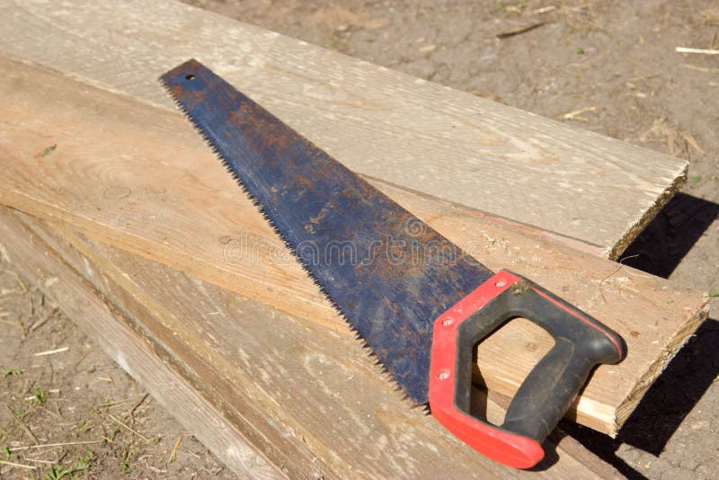 An Old Rusty Hacksaw on the Board. Stock Photo - Image of cutting ...