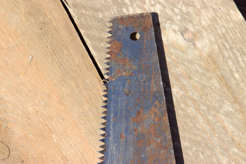 An Old Rusty Hacksaw on the Board. Stock Photo - Image of work ...
