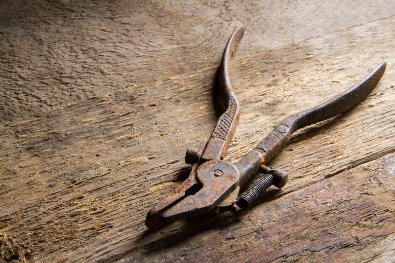 An Old Rusty Hand Tool on a Background of Wood. Stock Image - Image of ...