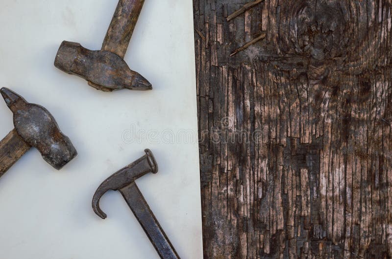 Old Rusty Hand Tools. Three Hammers and a Sheet of Paper on a Cr Stock ...