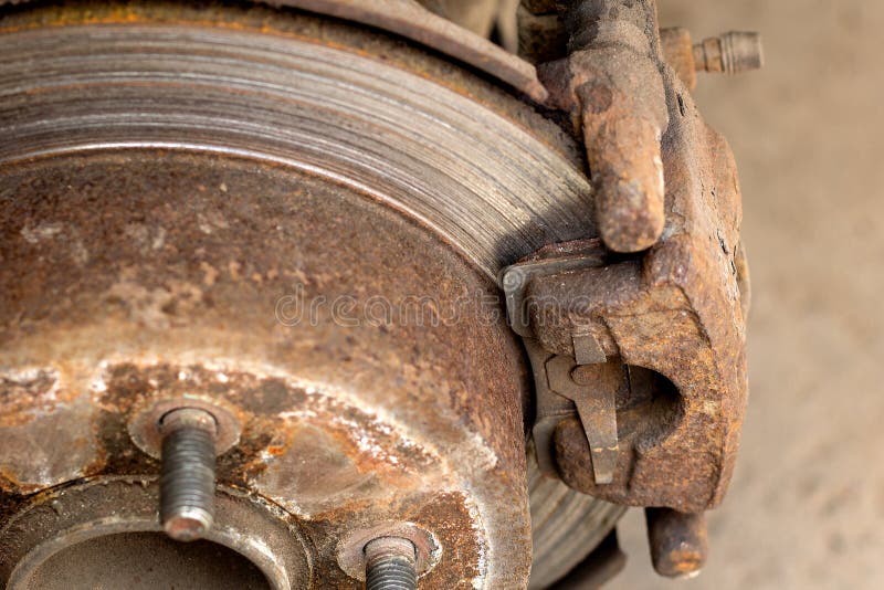 An Old Rusty Hub without a Wheel. Brake Disc and Brake Caliper on Car ...