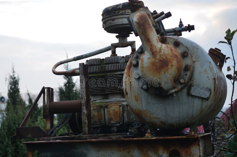 Old Rusty Industrial Engine Standing on the Street. Stock Image - Image ...