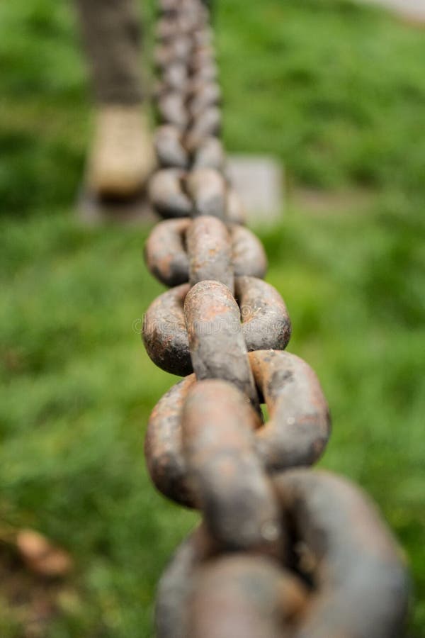 Old Rusty Iron Chain, on a Green Background Stock Photo - Image of ...
