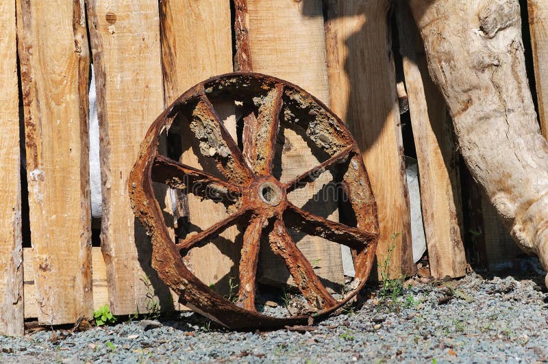 The old rusty iron wheel stock photo. Image of rusty - 32359546