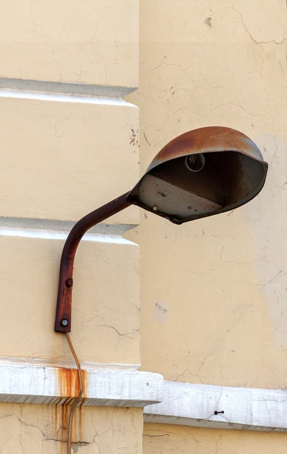 Rusty lamp on the wall stock photo. Image of evacuation - 152254442