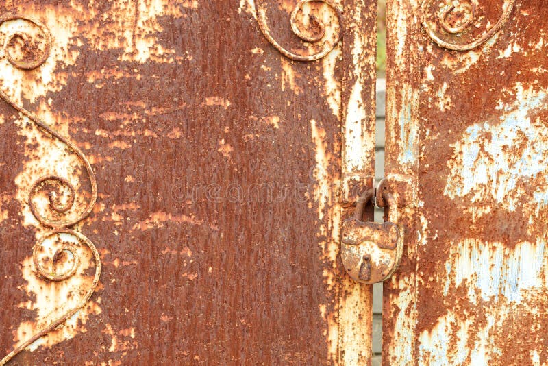 An Old Rusty Lock Connects a Rusty Gate. Rust on Old Metal Sheet ...