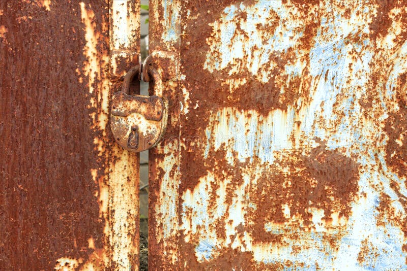 An Old Rusty Lock Connects a Rusty Gate. Rust on Old Metal Sheet Texture Stock Photo - Image of ...
