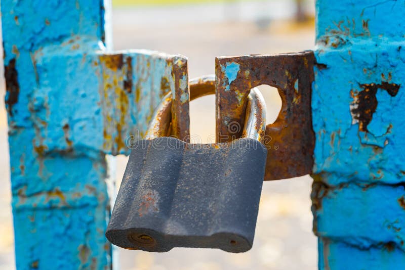 An Old Rusty Lock Hangs on a Metal Blue Gate Stock Photo - Image of ...