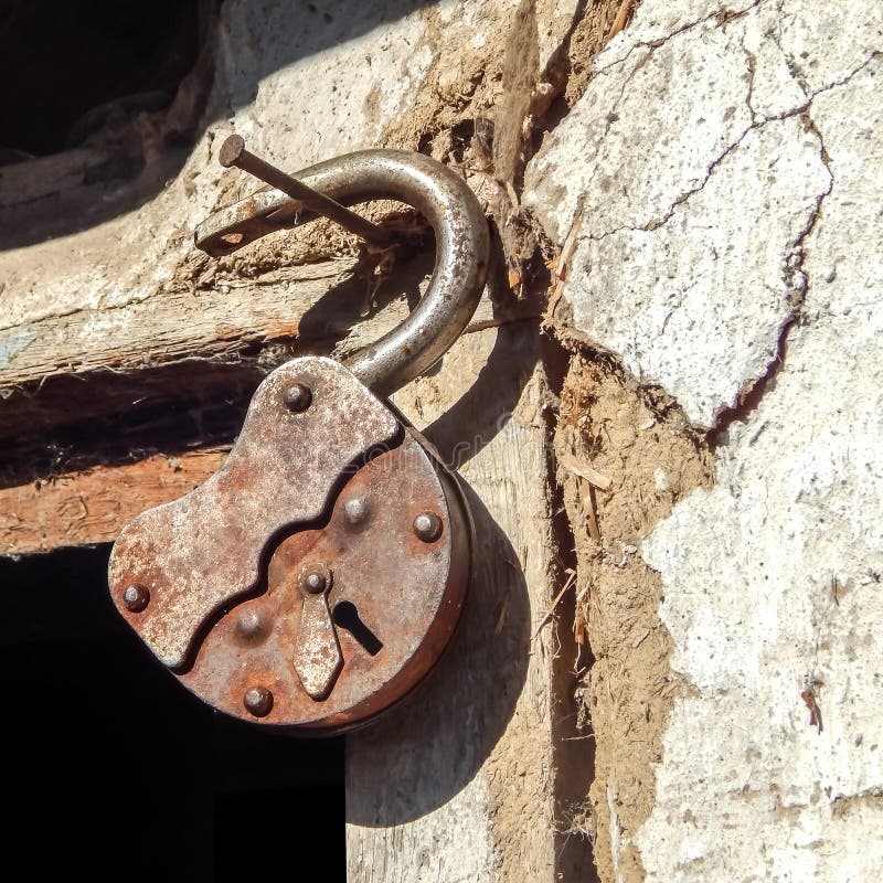 Old Rusty Lock Nailed To a Wall Stock Image - Image of group, keyhole ...