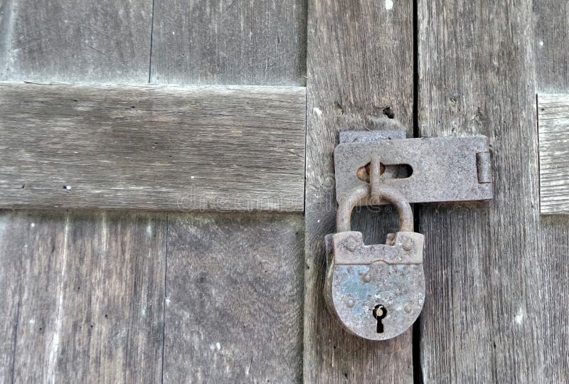 Old and Rusty Lock on Wooden Door of an Abandoned House Stock Image ...
