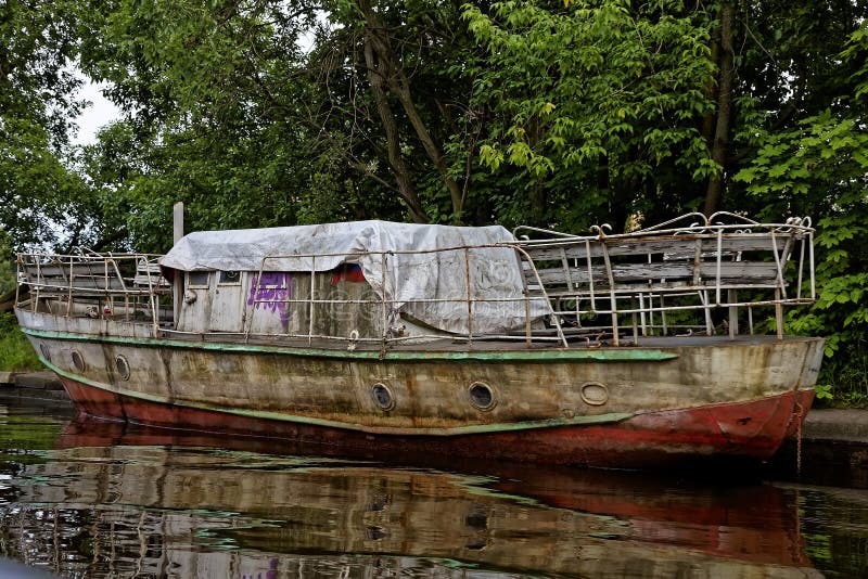 Old Rusty Machinery Boat on the River Dock. Stock Photo - Image of boat ...