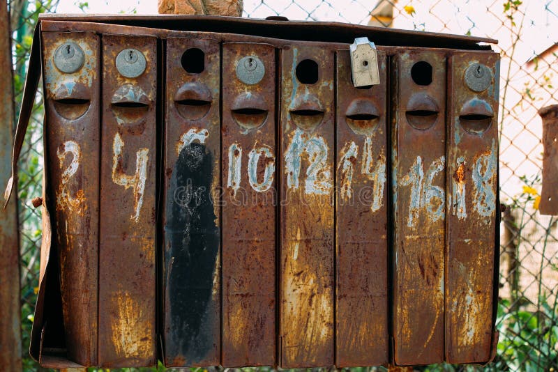 Old and Rusty Mailbox with Locks and Figures Stock Photo - Image of ...