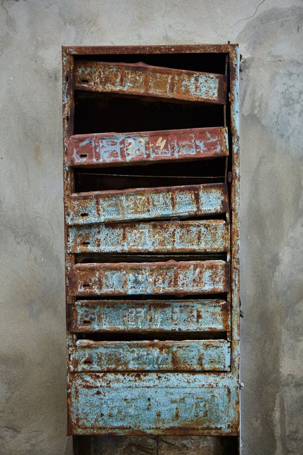 An Old Rusty Mailbox for Many Apartments or Houses. Stock Image - Image ...