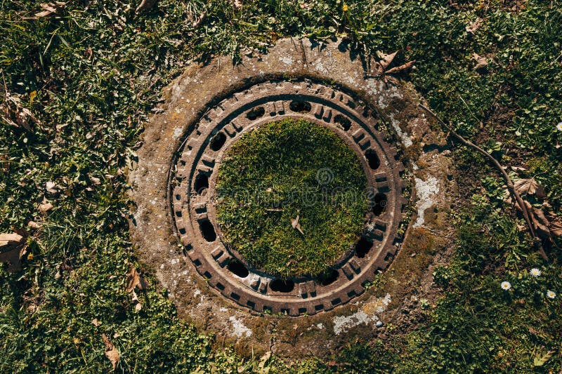 Old Rusty Manhole Covered with Grass Stock Image - Image of surface ...