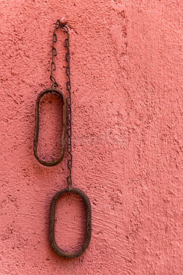 Old Rusty Metal Chain Hanging on a Red Wall Stock Photo - Image of grey ...