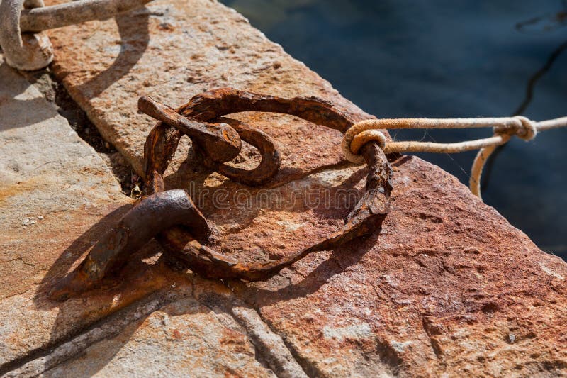 Old Rusty Metal Mooring Ring on an Old Stone Pier, Metal Corrosion ...