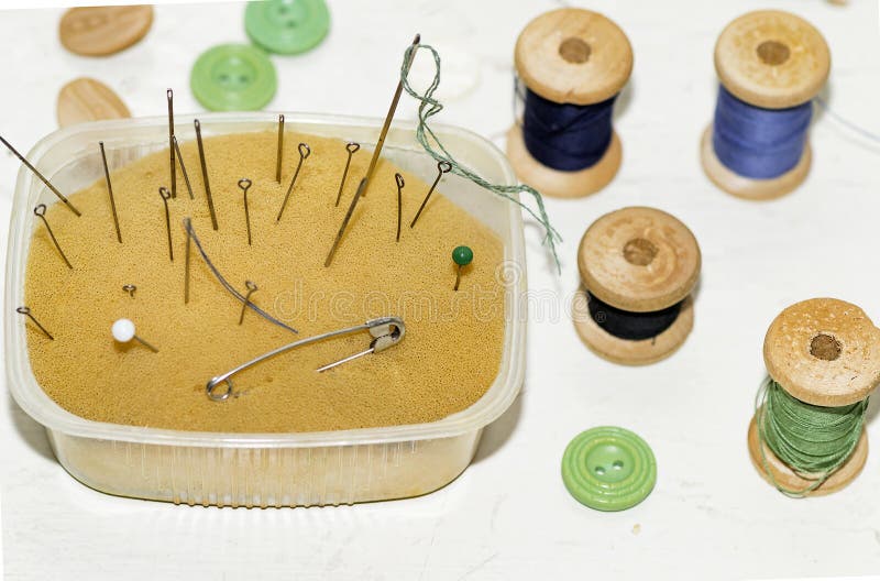 Old Rusty Metal Needles, Pins and Wooden Spools of Thread Stock Photo ...