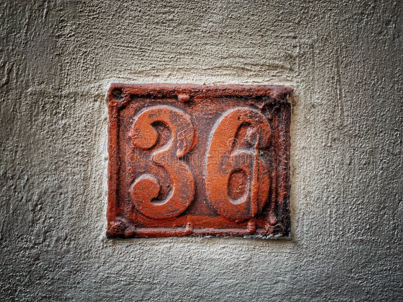 Old Rusty Metal Plate with Number 36 Hung on a Brick Wall Stock Photo ...