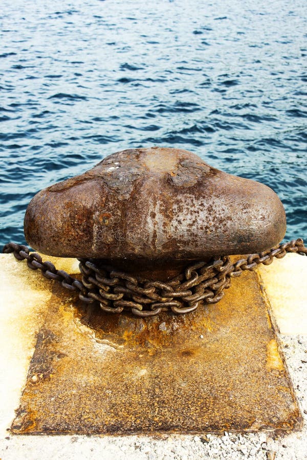 Old and rusty mooring post stock image. Image of rope - 151875435