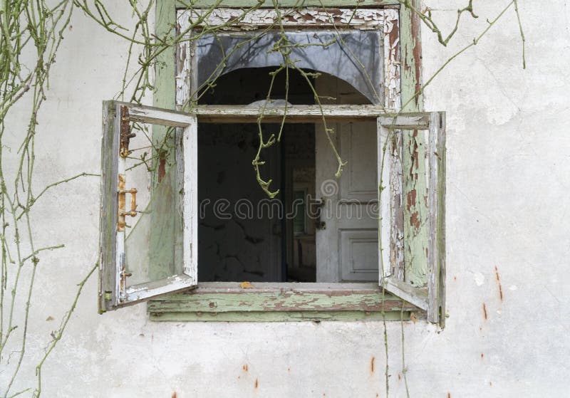 An Old and Rusty Open Window with Broken Glass in Middle at Chernobyl ...