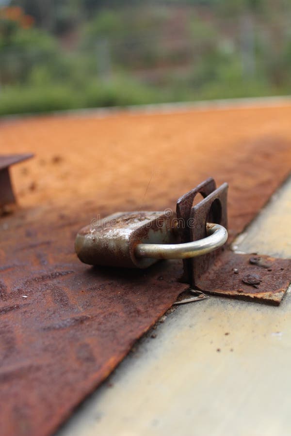 An old rusty padlock stock photo. Image of weapon, color - 254847880