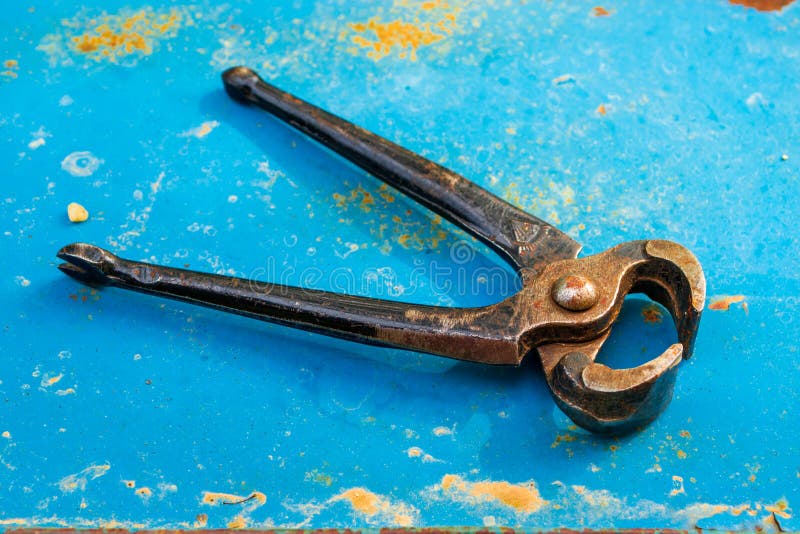 Old Rusty Pincers on a Blue, Rusty Metal Background. First-class Levers ...