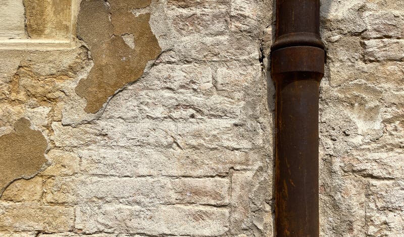 Old Rusty Pipe on a Stone Wall. Stock Image - Image of rock, history ...