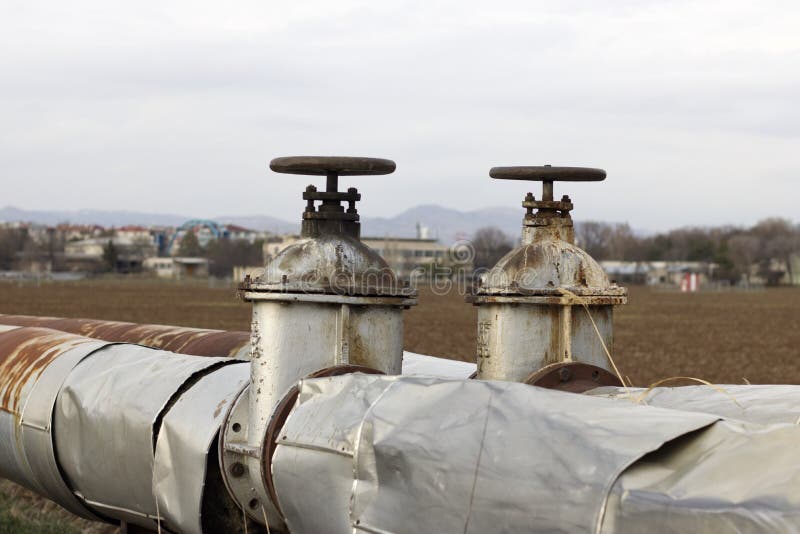 An Old Rusty Pipeline in the Land with Valves Stock Image - Image of ...