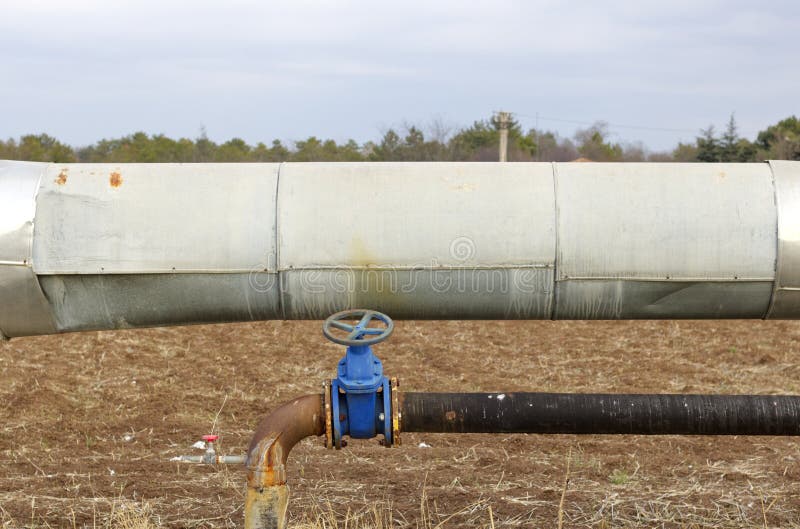 An Old Rusty Pipeline in the Land with Valves Stock Image - Image of ...