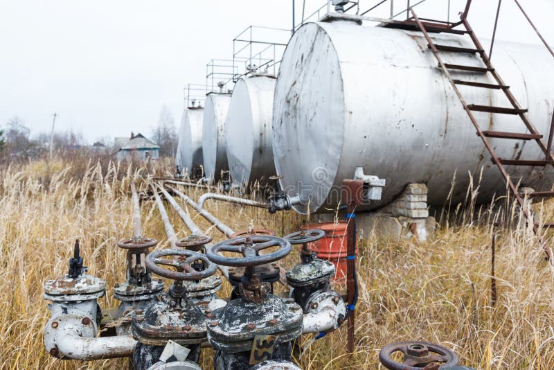 Old rusty pipes and tanks stock photo. Image of production - 41248576