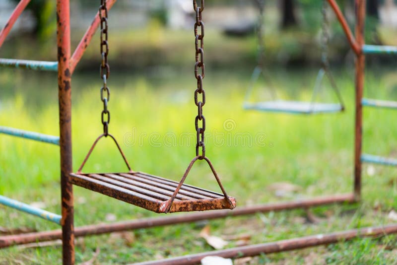 Old Rusty Playground Swing in the Park Stock Photo - Image of play ...