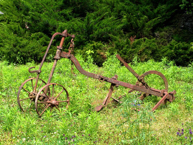 An old rusty plow stock photo. Image of land, wheel - 228516924