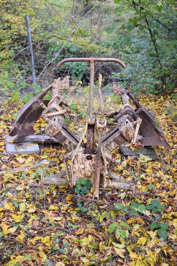 Old Rusty Plow in the Forest - Tractor Connection Side Stock Image ...