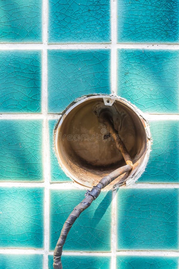 Old and Rusty Pool Light Hanging from Swimming Pool Wall Stock Image ...