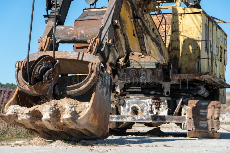 An Old Rusty Quarry Excavator is Located on the Territory of a Mining ...