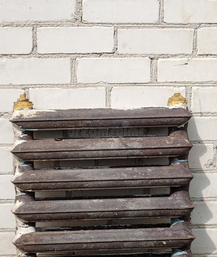Old Rusty Radiator Against a Brick Wall Stock Photo - Image of cold ...