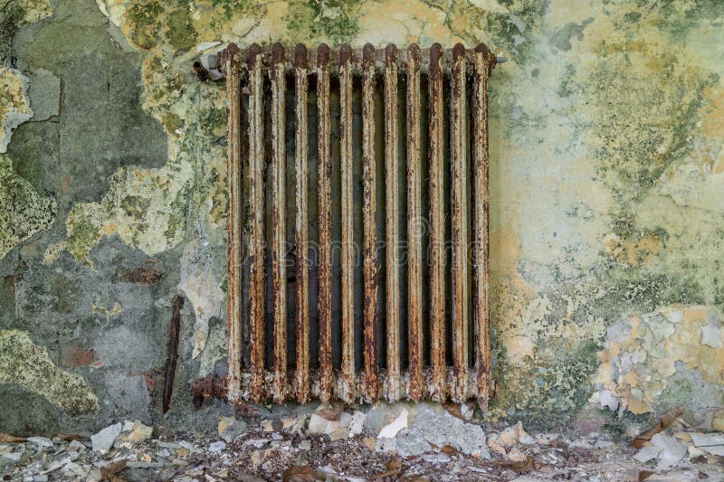 A Old Rusty Radiator on a Wall with Peeling Plaster Stock Photo - Image ...