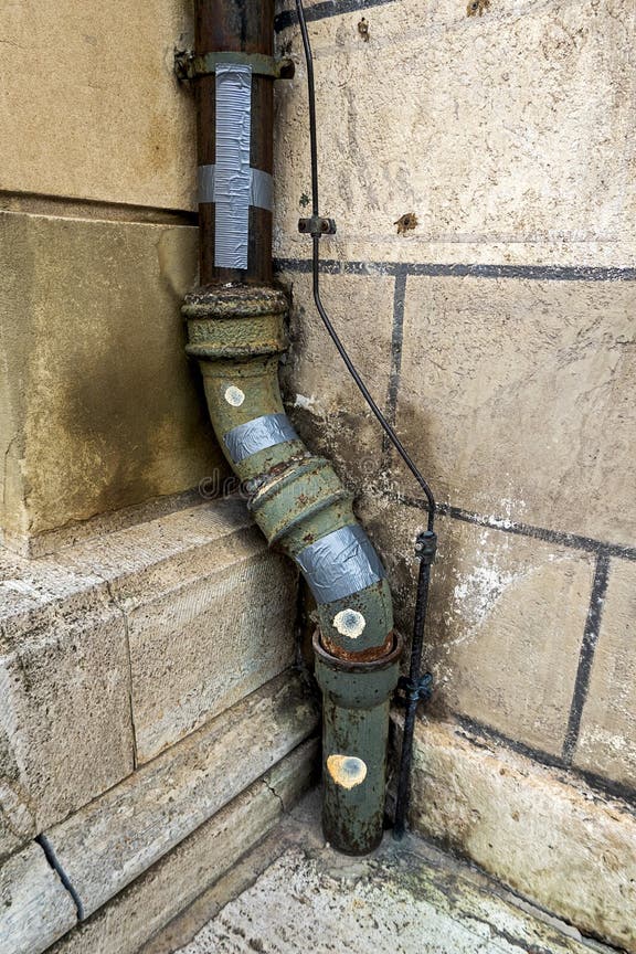 .old, Rusty Rain Gutter Repaired with Tape Stock Photo - Image of ...