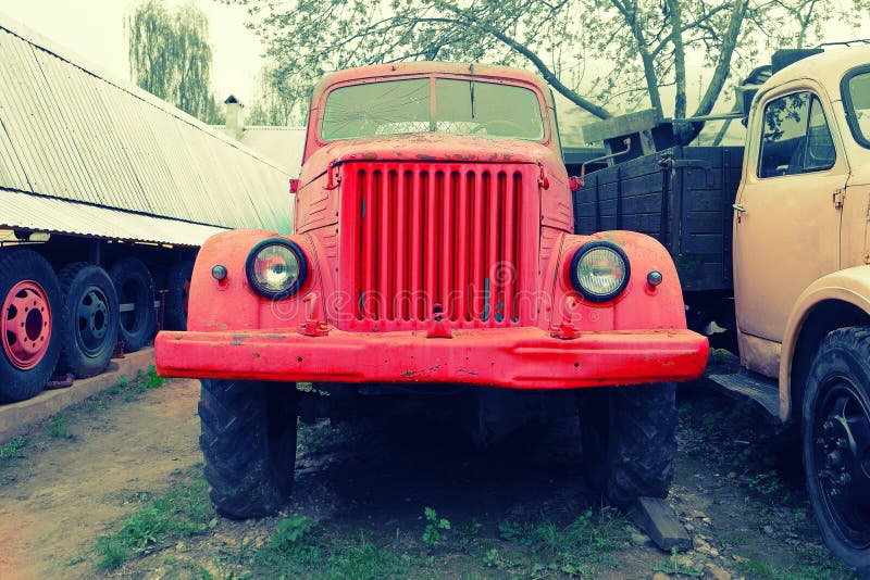 Old Rusty Red Farm Trucks Fading in Time Frontview Stock Image - Image ...