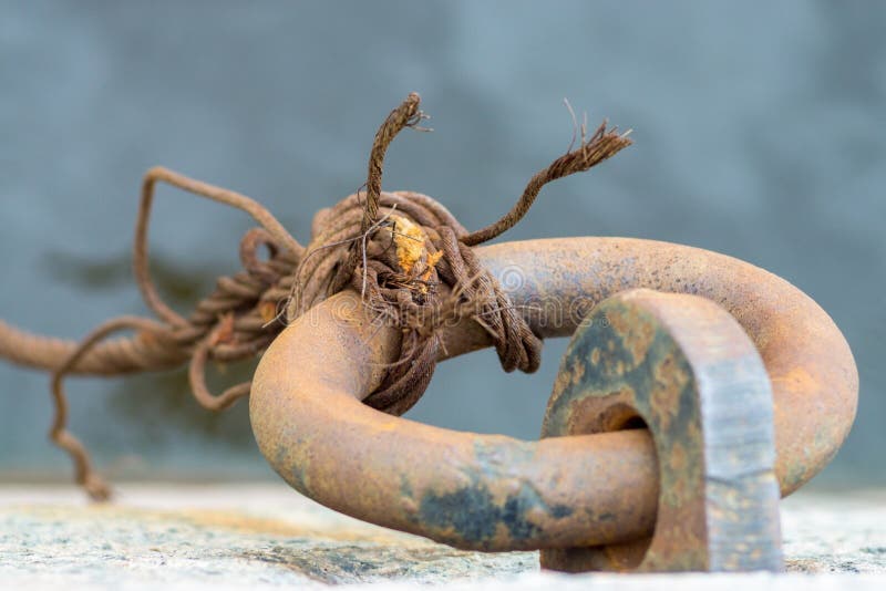 Old Rusty Ring with the Broken-off Iron Cable Stock Photo - Image of ...