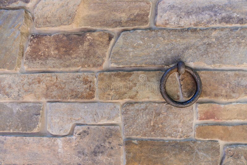 Old Rusty Ring Fixed in a Stone Brick Wall Stock Photo - Image of ...
