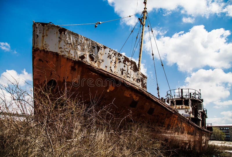 Old Rusty River Ship on the Shore Stock Photo - Image of pollution ...
