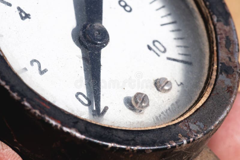 Old Rusty Round Industrial Pressure Gauge with Numbers on a White Dial ...