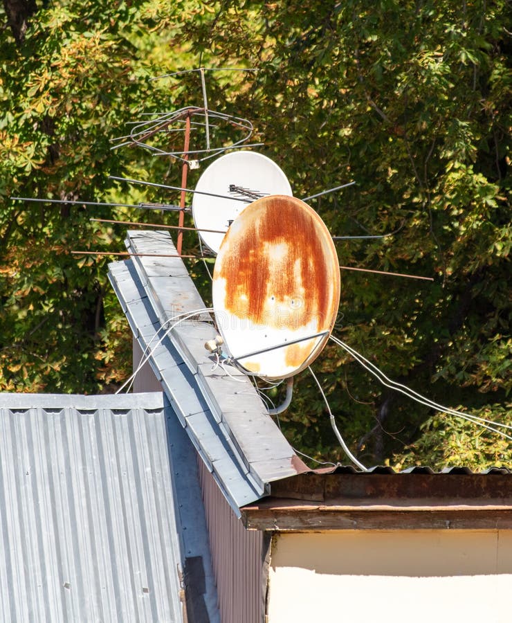 Old Rusty Satellite Dish on the Roof of a House Stock Photo - Image of ...