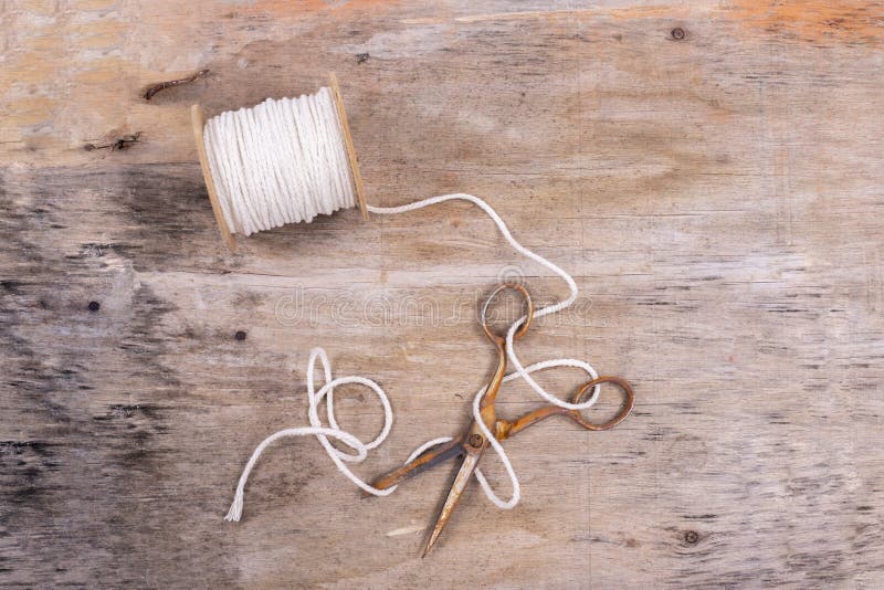 Scissors, Tangled Colored Threads and Spools of Thread are on the ...