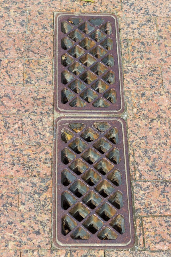 Old Rusty Sewer Drain at a Parking Ramp Stock Photo - Image of manholes ...