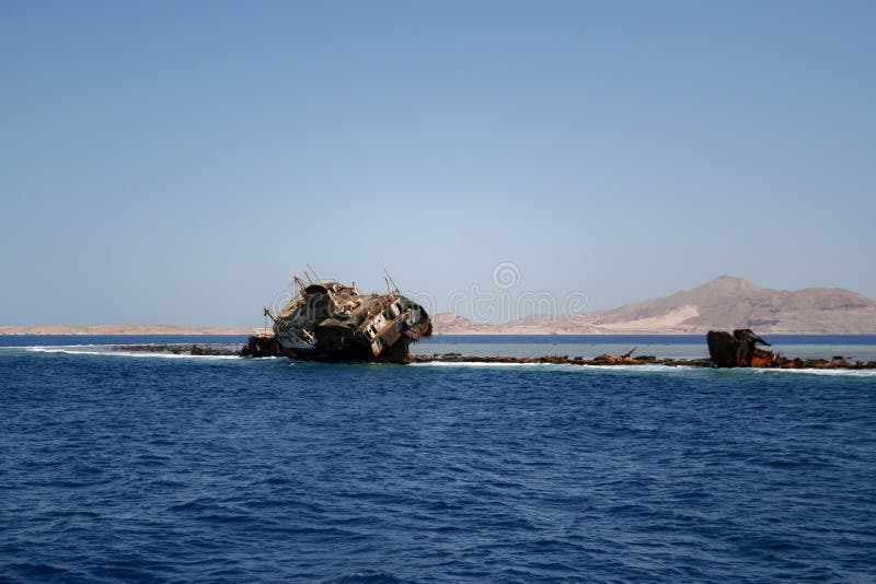 Old Rusty Ship Stranded, in the Sea, Against the Background of Sandy ...